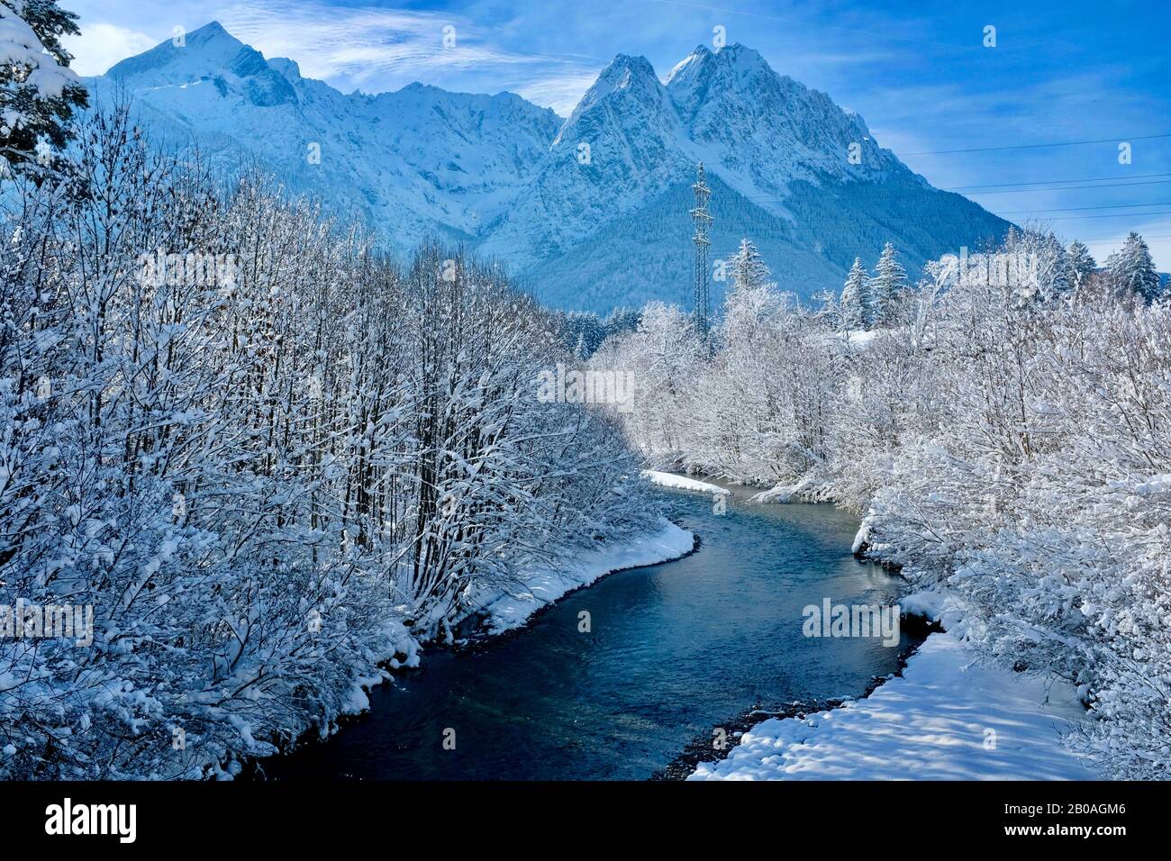 Alps Winter Scene with Stream Stock Photo - Alamy