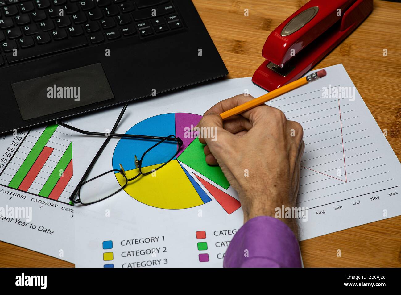 Desktop Business workspace with a laptop, a #2 pencil and Stapler and ...