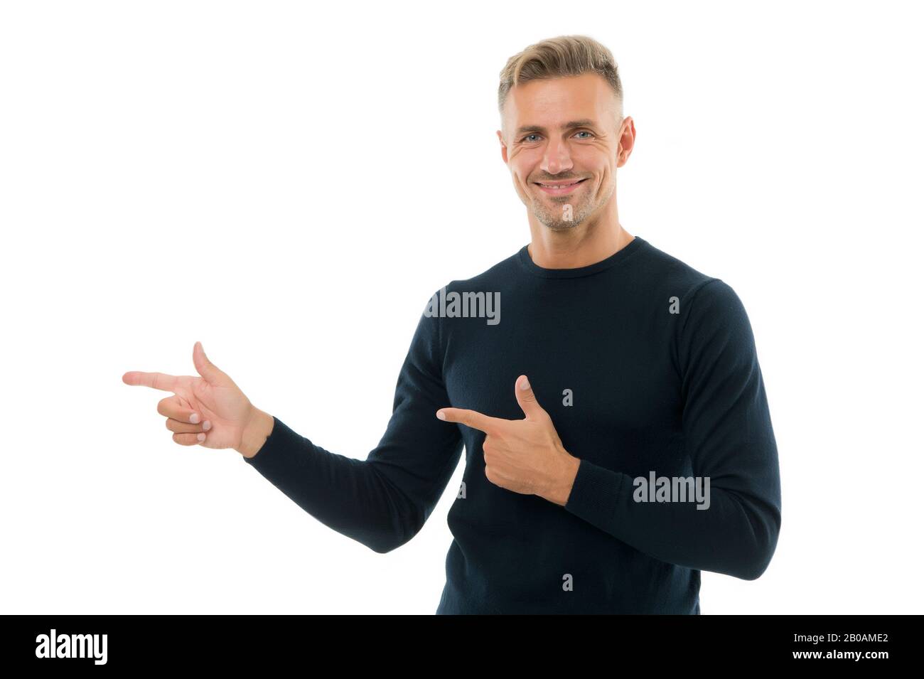 Your logo. Happy man pointing fingers isolated on white. Handsome guy ...