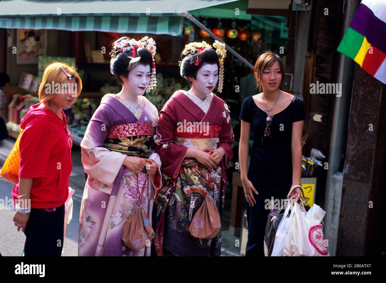 JAPAN, KYOTO, GION DISTRICT, GEISHA IN KIMONO POSING WITH PEOPLE Stock ...