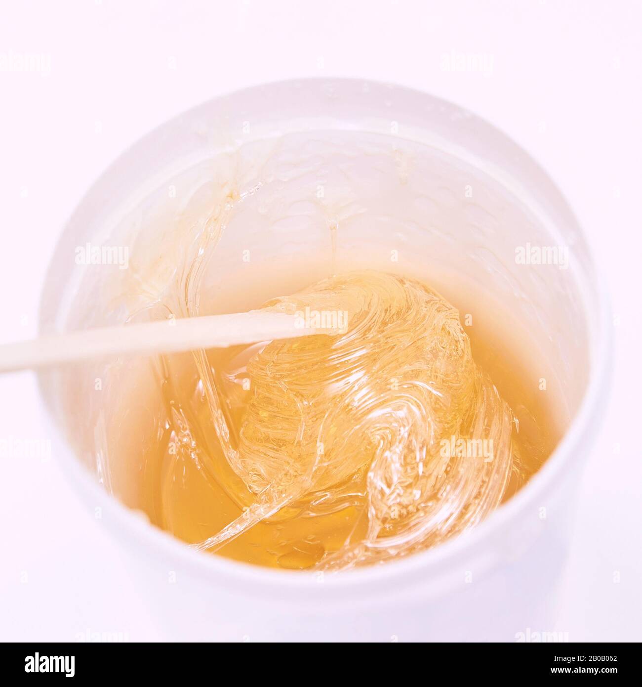 Hair removal at spa luxury studio. Wax Shugaring. Hot sugar. Product ...