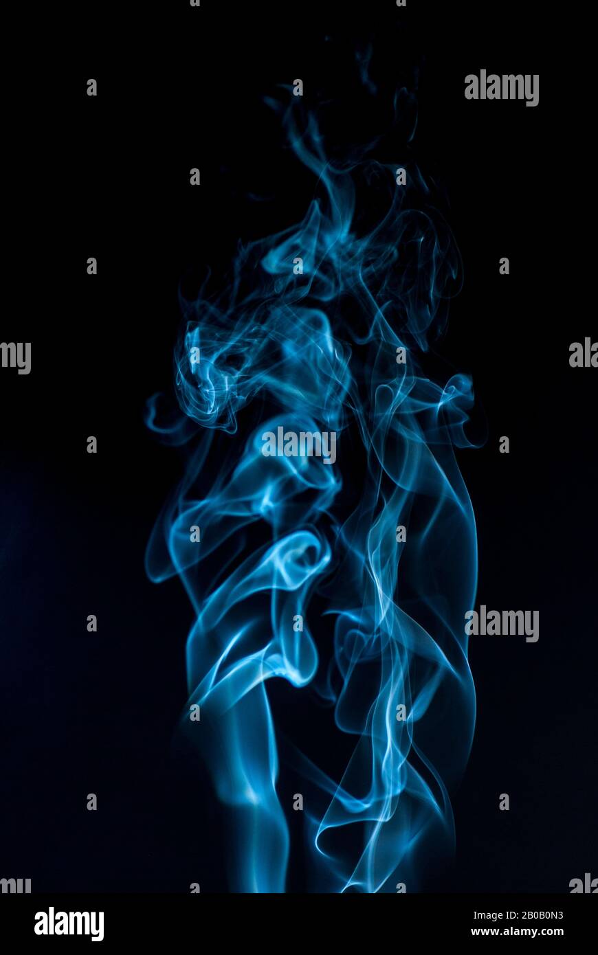 Beautiful smoke on the black background - macro photo. The concept of ...
