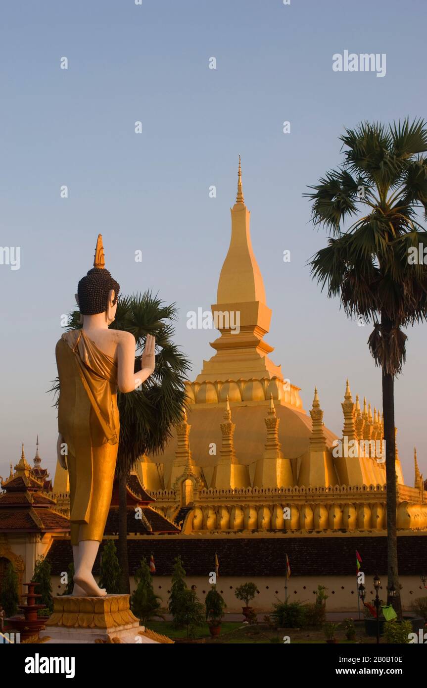 LAOS, VIENTIANE, THAT LUANG STUPA IN EVENING LIGHT, BUDDHA STATUE Stock ...