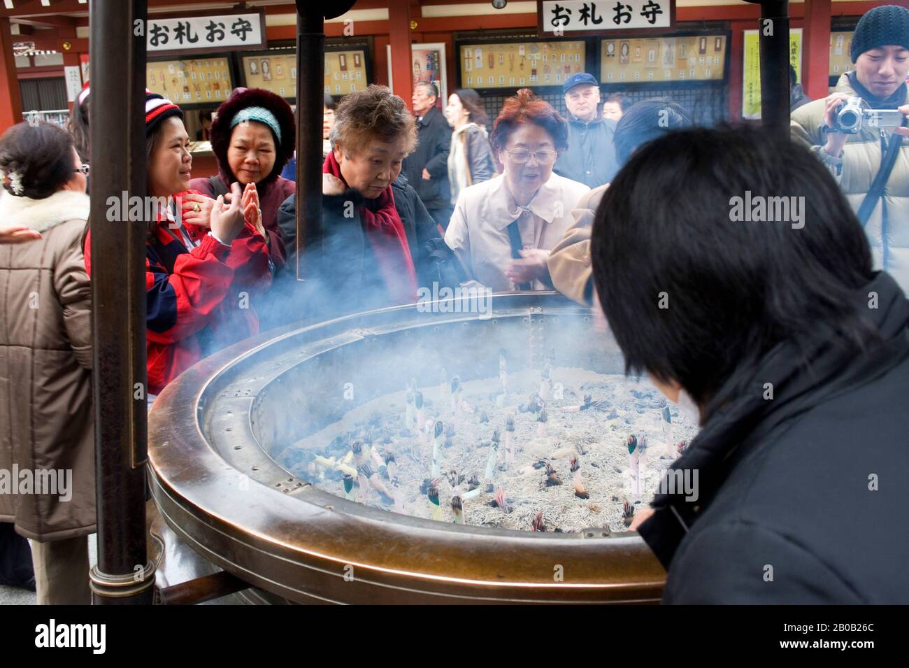 JAPAN, TOKYO, ASAKUSA SENSOJI BUDDHIST TEMPLE, PEOPLE OFFERING INCENSE ...