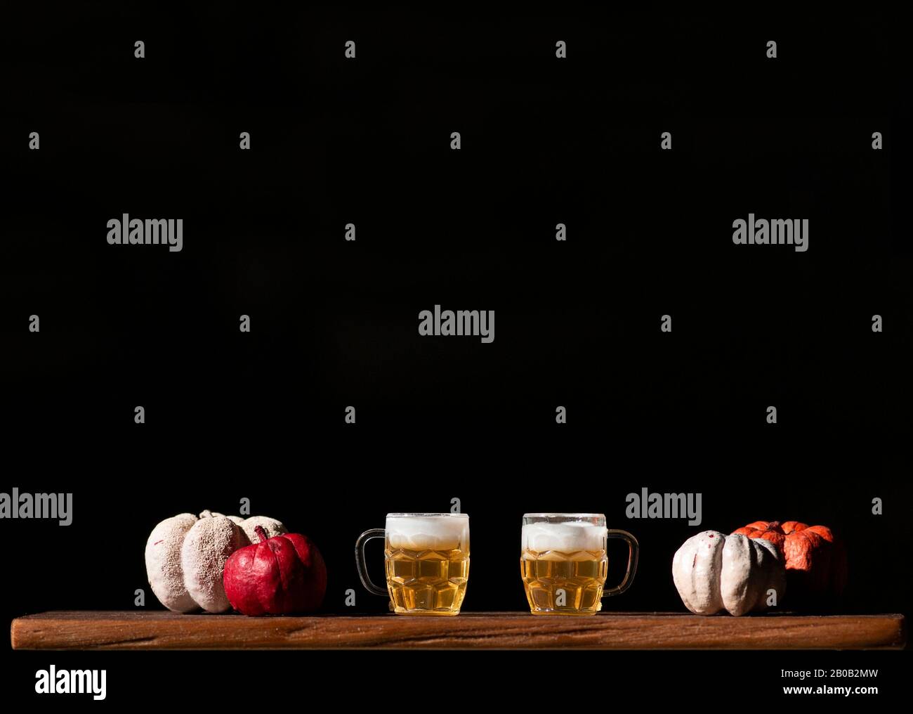 Beer Mugs and Fall Pumpkins in Evening Stock Photo - Alamy