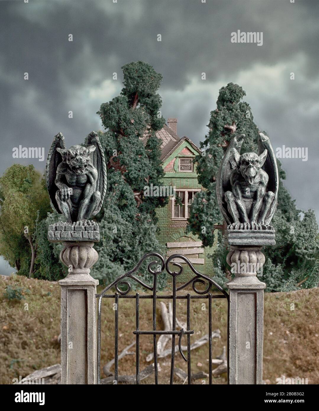Gargoyle Statues on Iron Gated Residence Entrance Stock Photo - Alamy