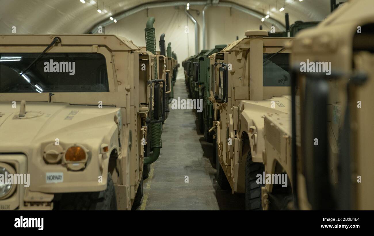 U.S. Marine Corps High Mobility Multipurpose Wheeled Vehicle are staged ...