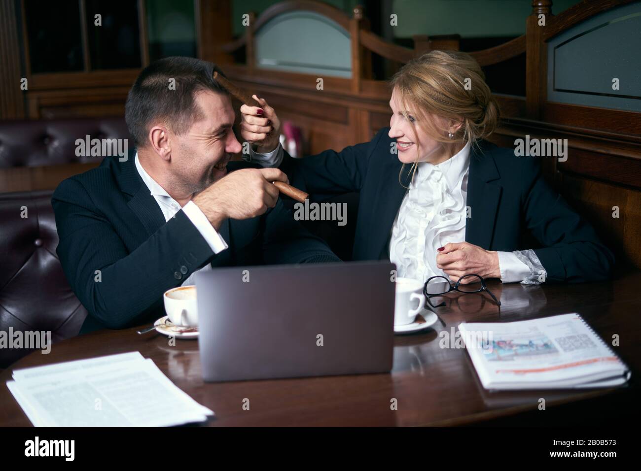 Business people talking over coffee in a cafe Stock Photo - Alamy