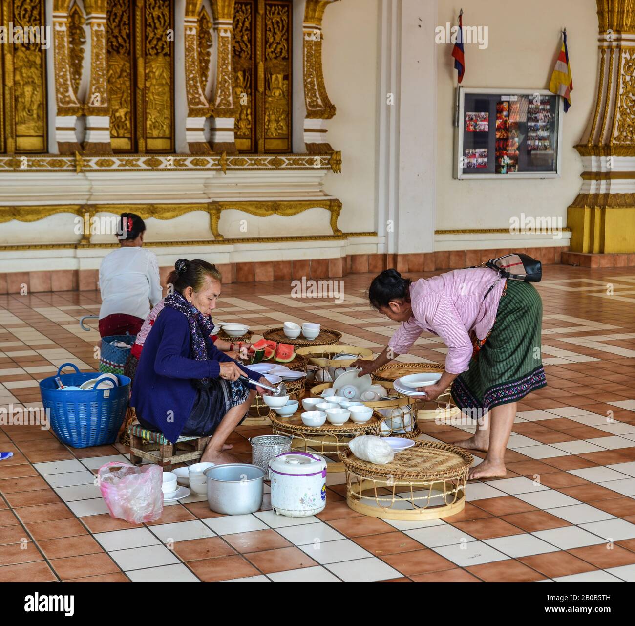 Vientiane, Laos - Jan 29, 2020. Women cooking at Buddhist temple in Vientiane. Lao Buddhism is a ...