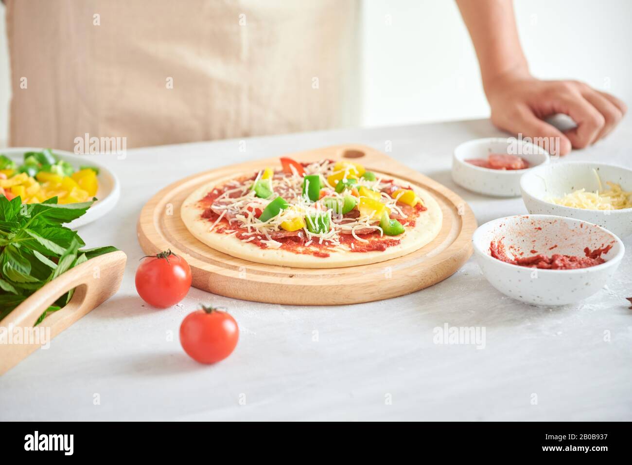 Step-by-step boss makes a pizza margarita. Dough and pizza ingredients ...