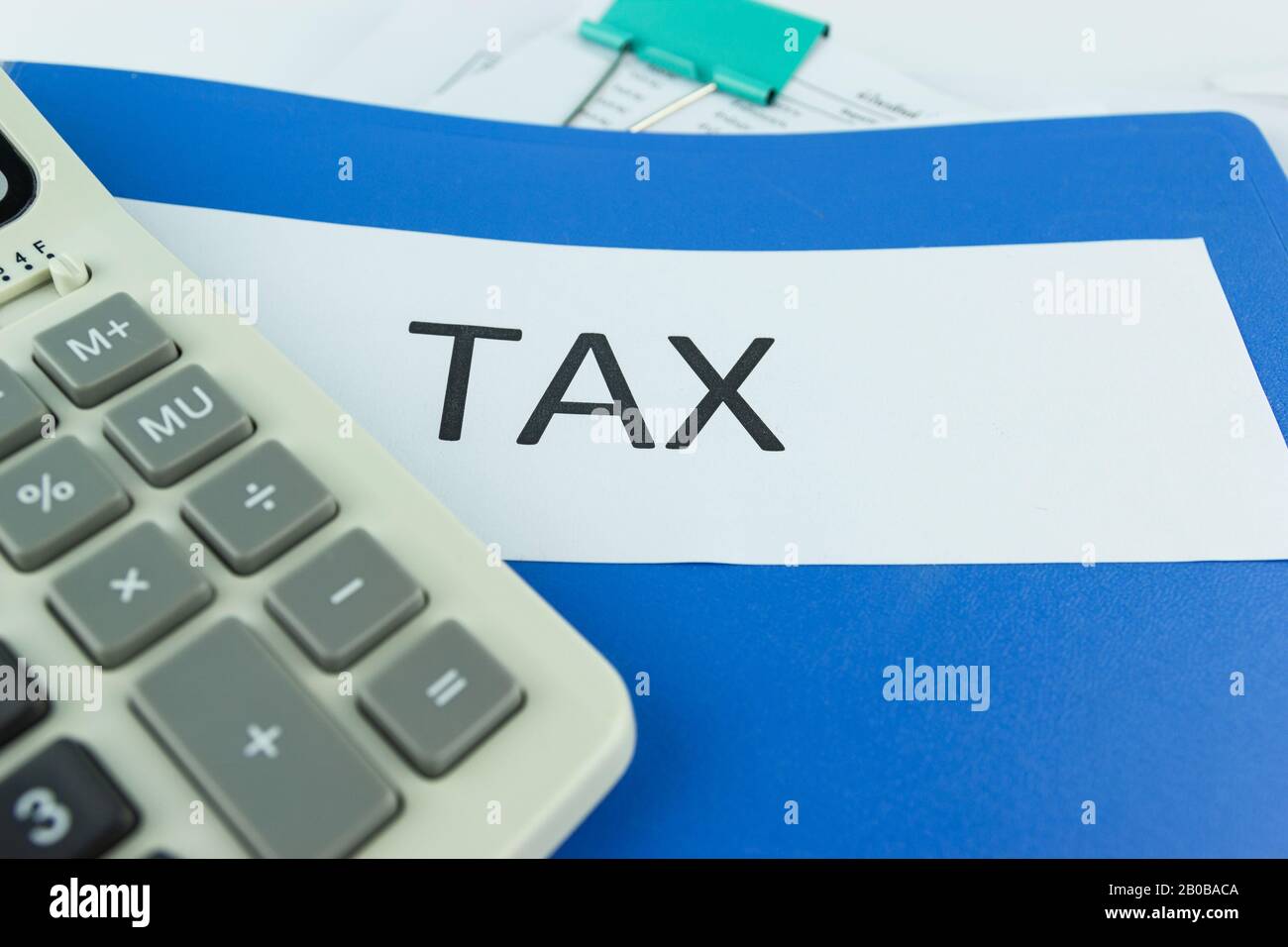 Folder Tax documents and paper files with calculator concept Annual tax ...