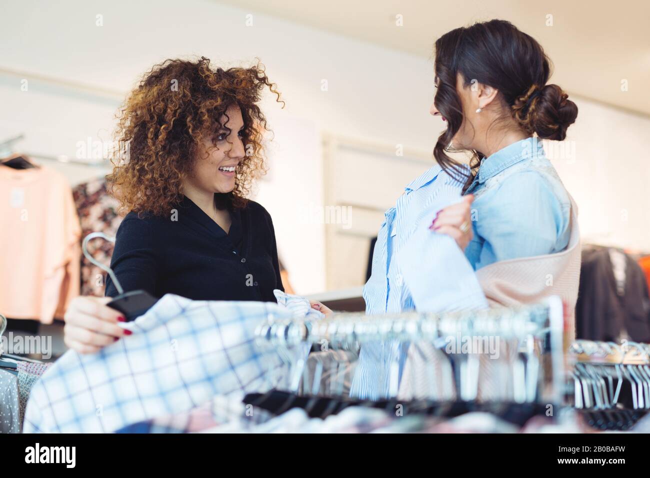Female customer buying new hi-res stock photography and images - Alamy