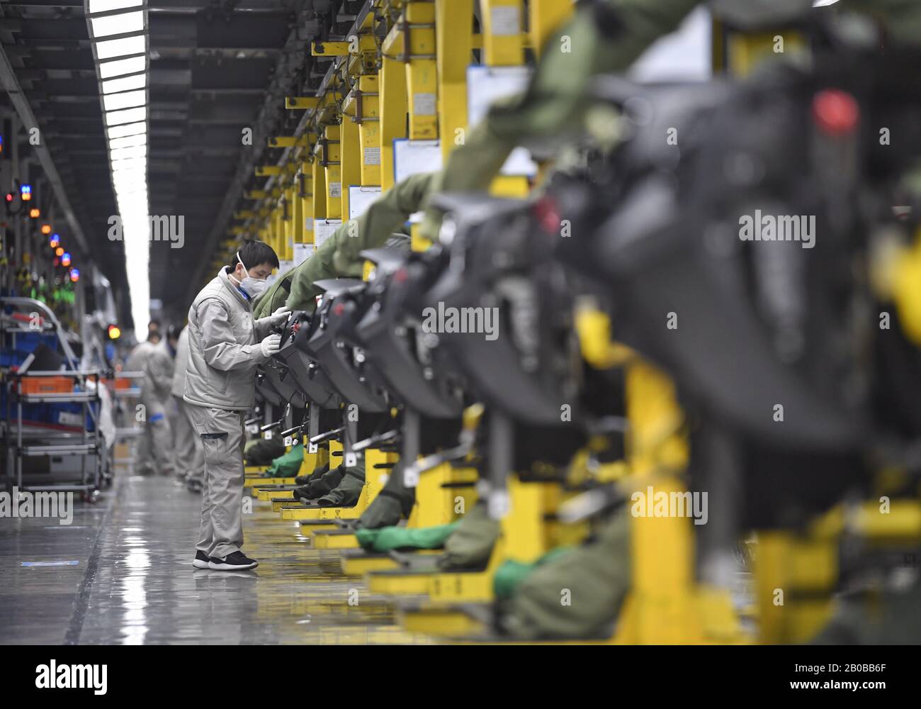 Beijing, China's Sichuan Province. 19th Feb, 2020. Staff members work ...