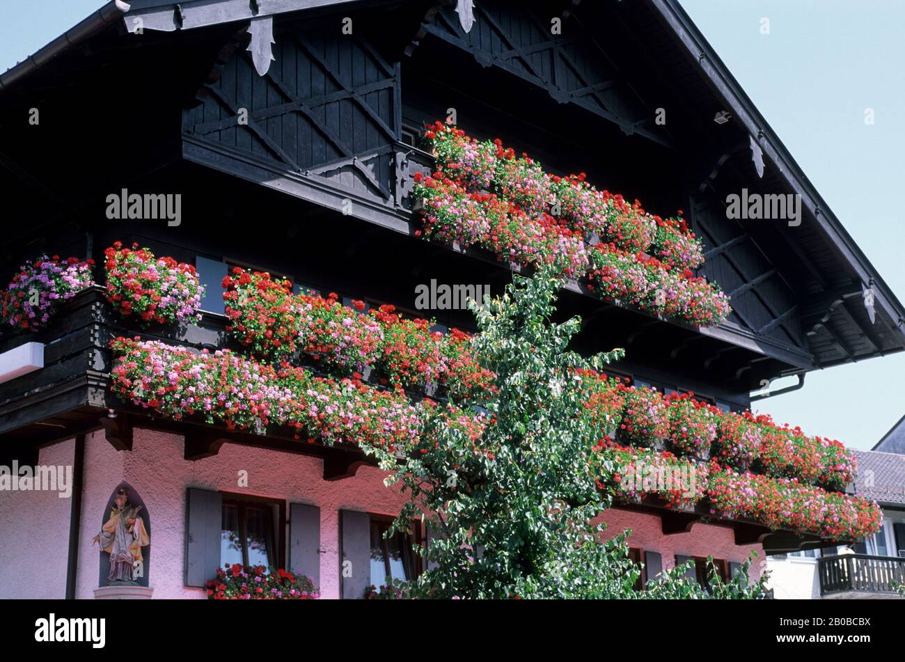 German house with geraniums hi-res stock photography and images - Alamy