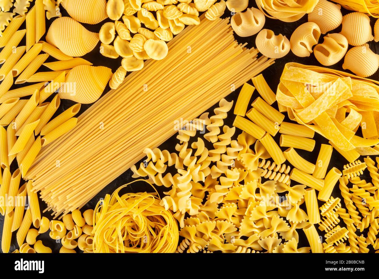 Pasta background texture, a flat lay of many different pasta types ...