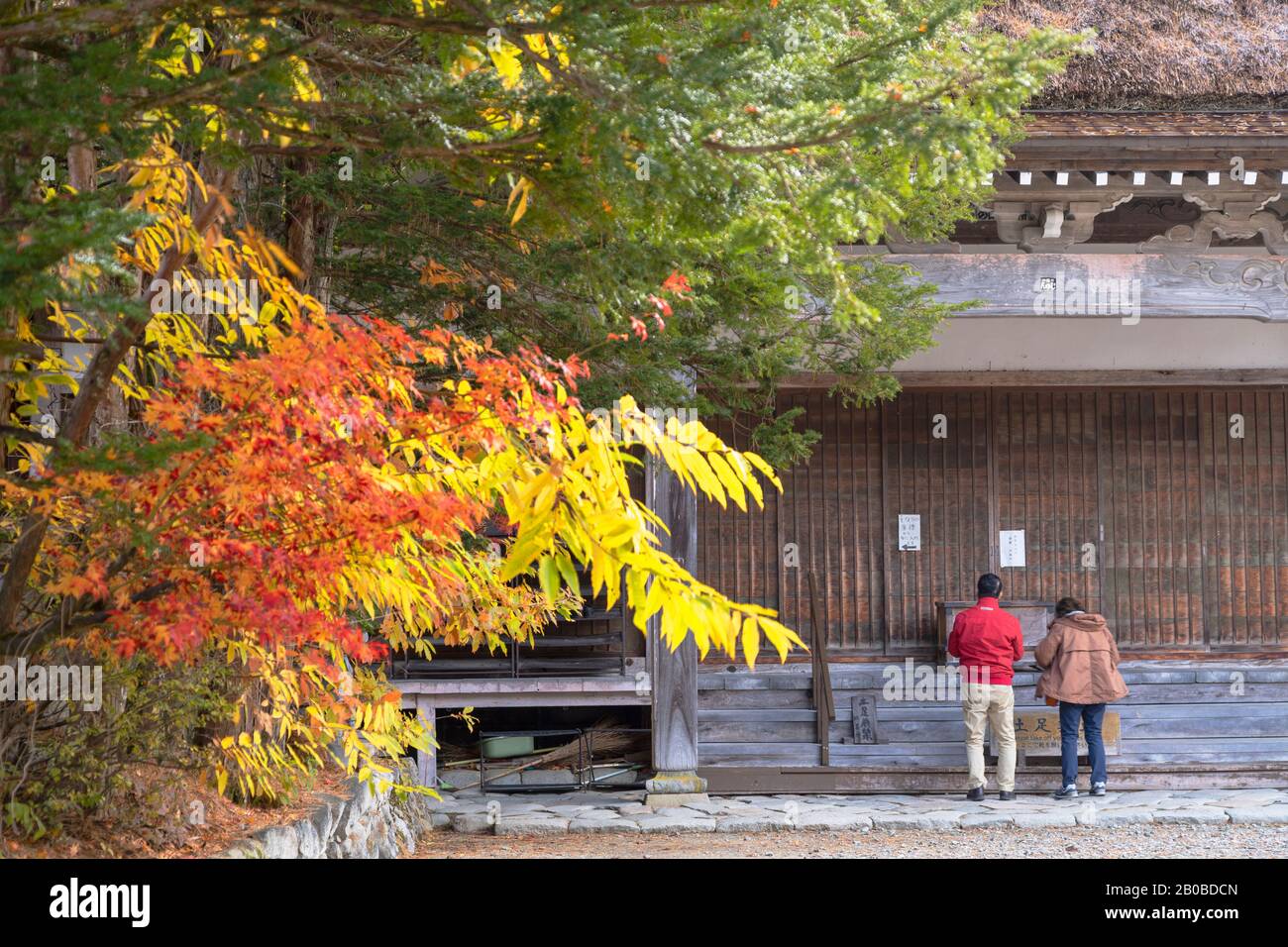 Couple at temple, Ogimachi (UNESCO World Heritage Site), Shirakawa-go ...