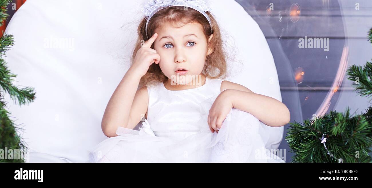 Happy amazed female kid emotion. Suprised and thinking child studio ...