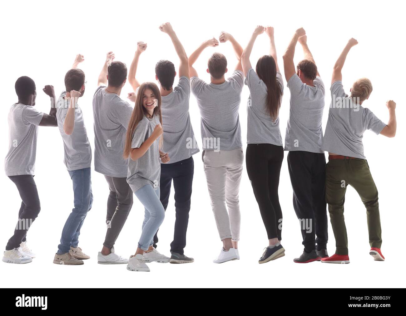 rear view. a group of happy young people looking forward Stock Photo ...