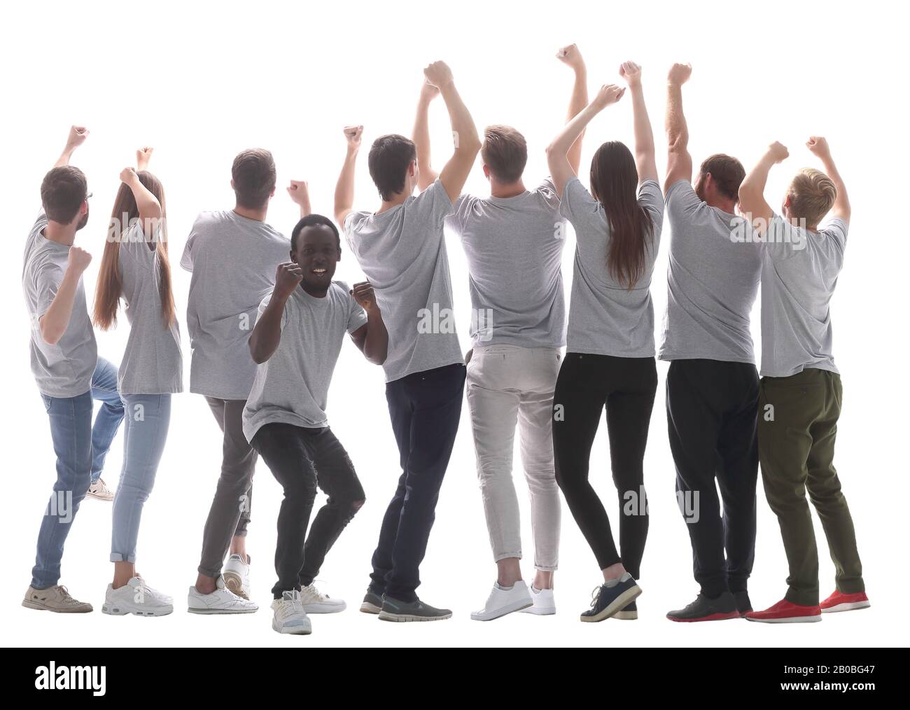 rear view. a group of happy young people looking forward Stock Photo ...