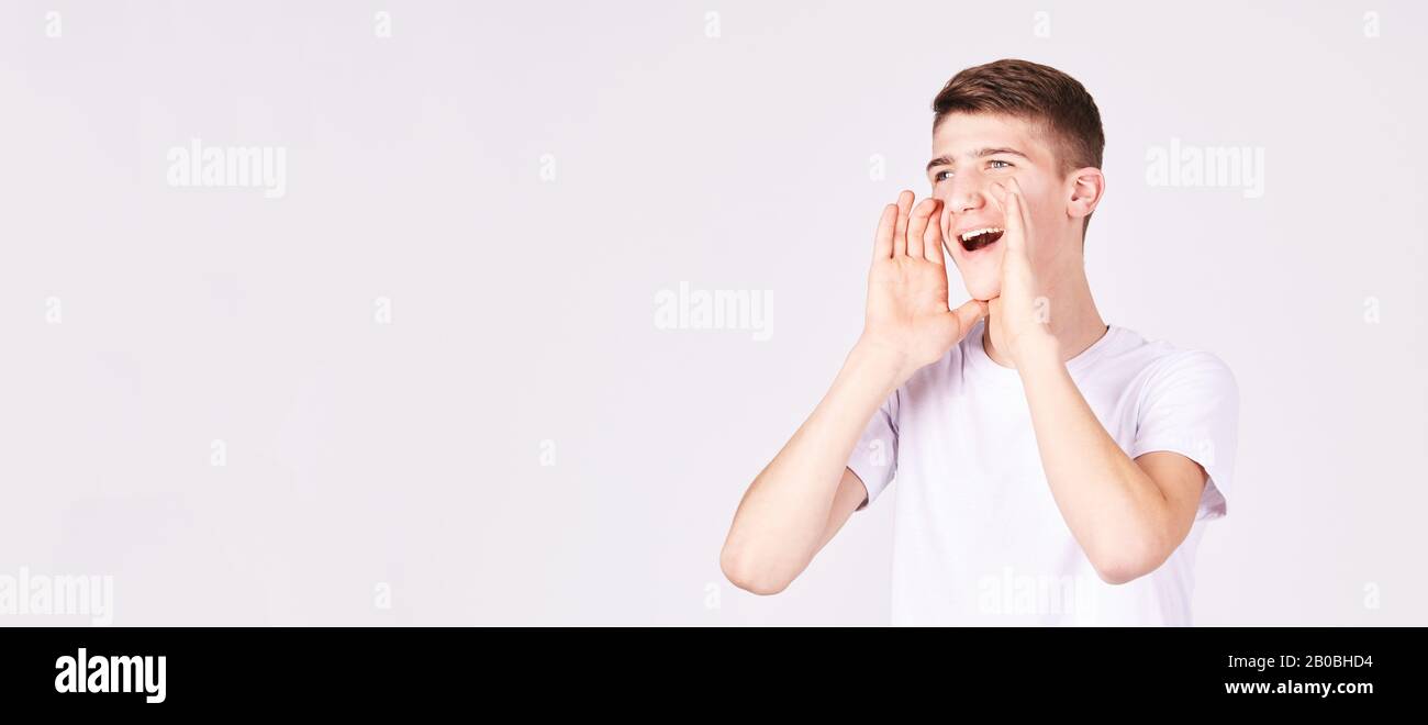 Happy teen man yelling loud. Fun voice concept. Adorable boy portrait ...