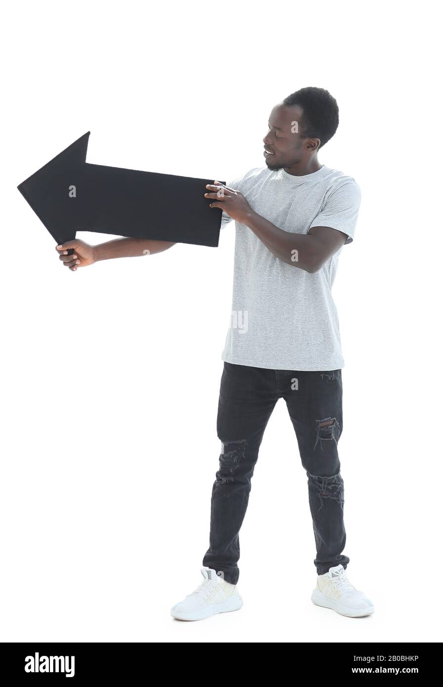 in full growth. casual guy pointing in the right direction Stock Photo ...