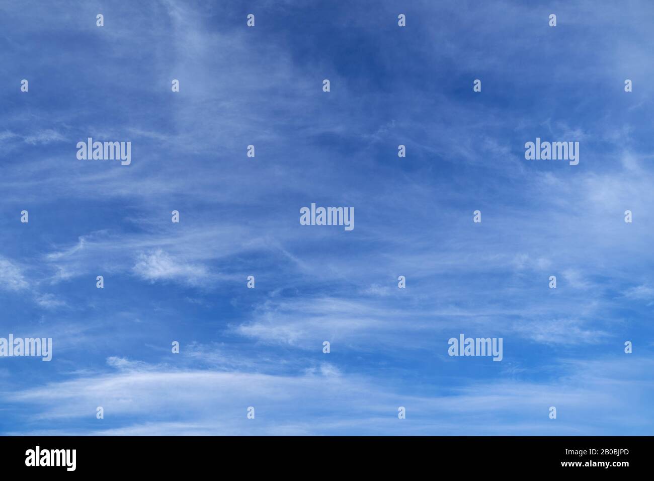 Bright beautiful blue sky with soft clouds for background or texture ...