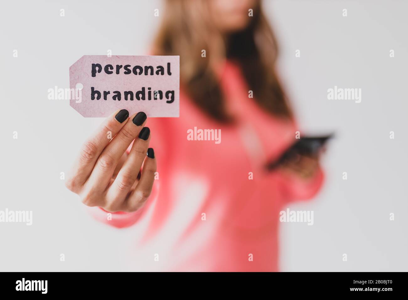 concept of influencers and fame, girl holding Personal Branding message ...