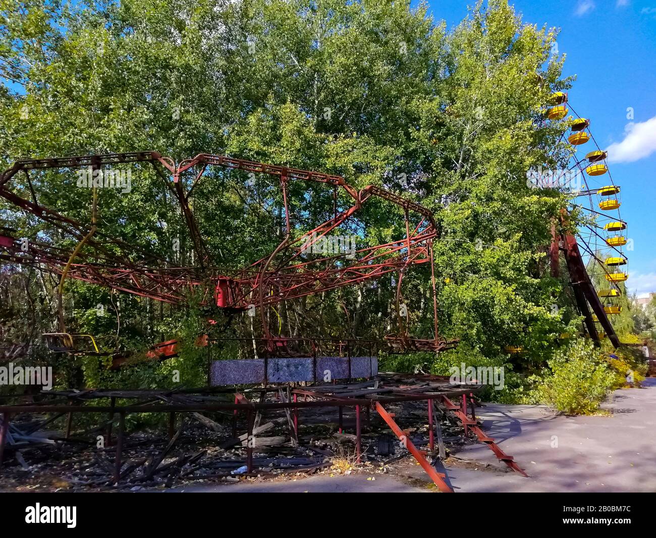 Ferris wheel and carousel in the iconic abandoned amusement park of ...