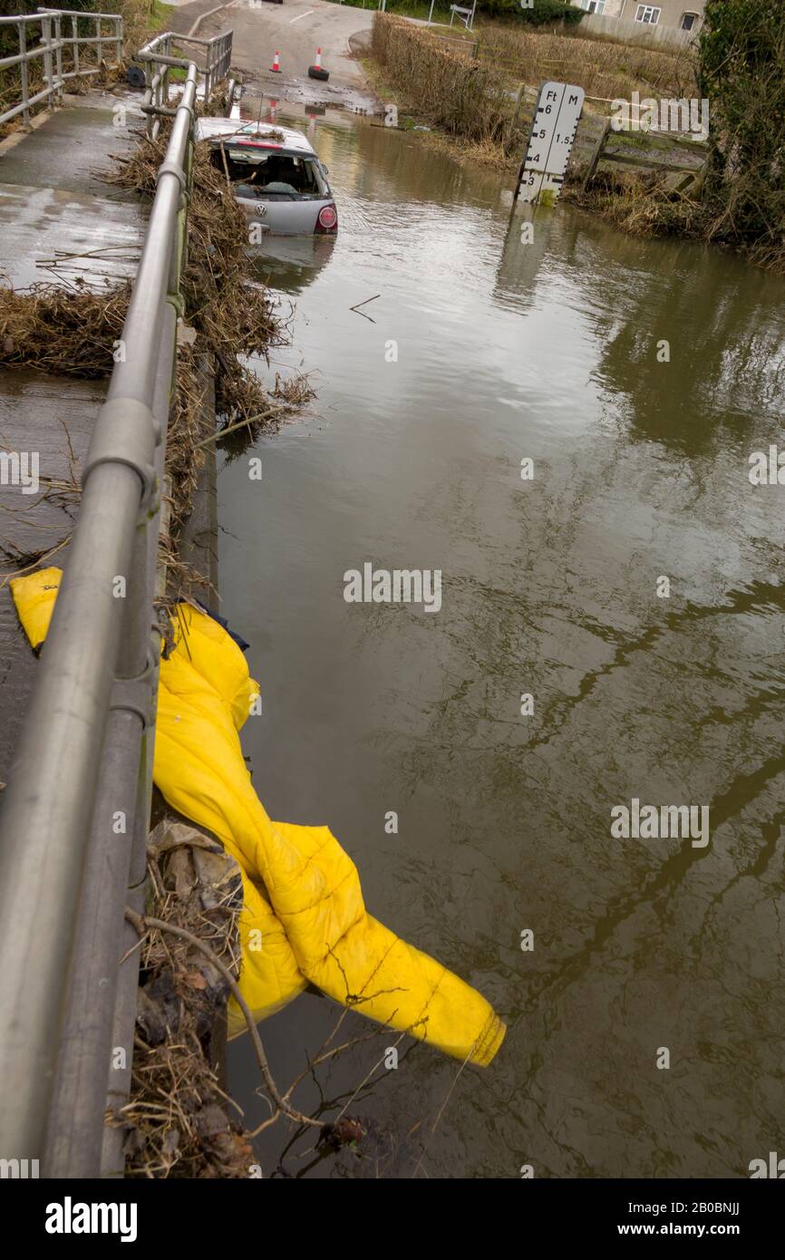 Car stuck in Ford after storm Dennis, flooded Trescott ford Stock Photo ...