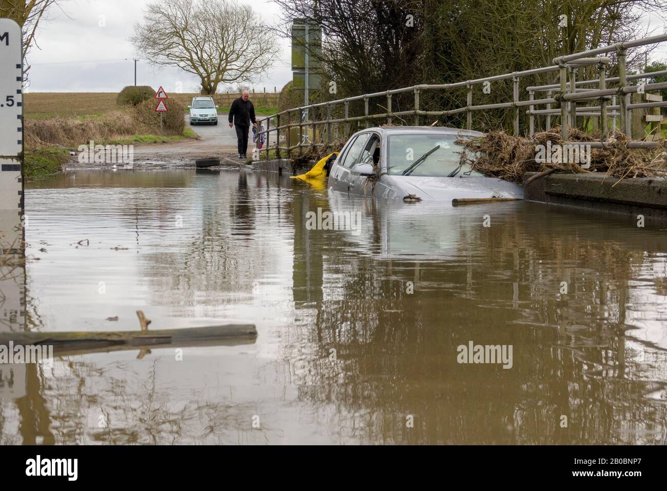 Car stuck in Ford after storm Dennis, flooded Trescott ford Stock Photo ...