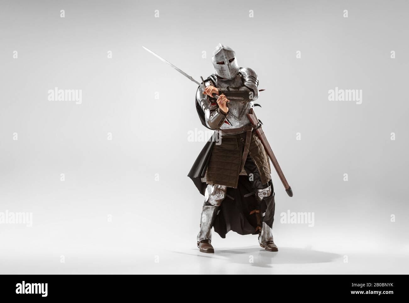 Brave armored knight with professional weapon fighting isolated on ...