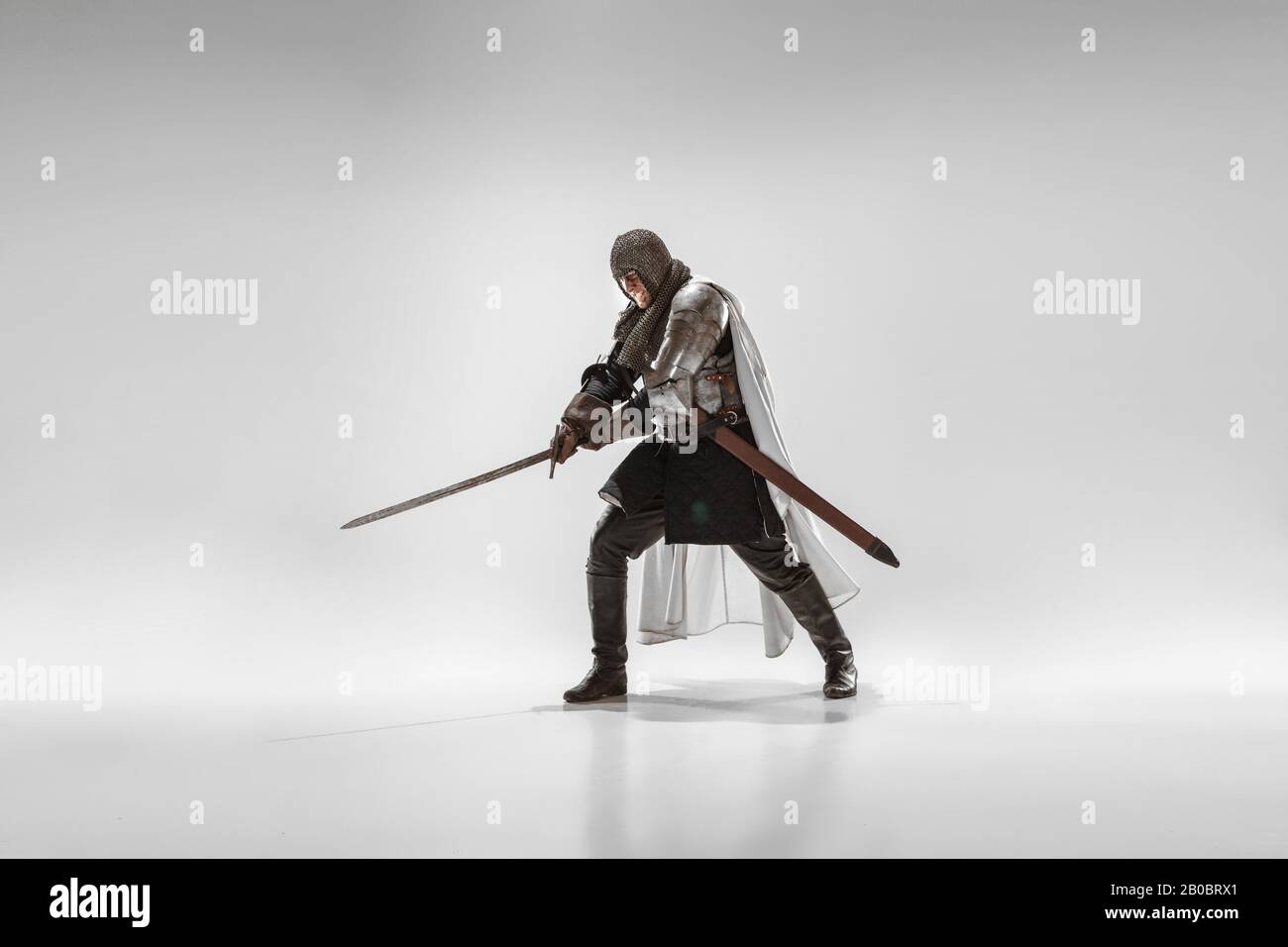 Brave armored knight with professional weapon fighting isolated on ...