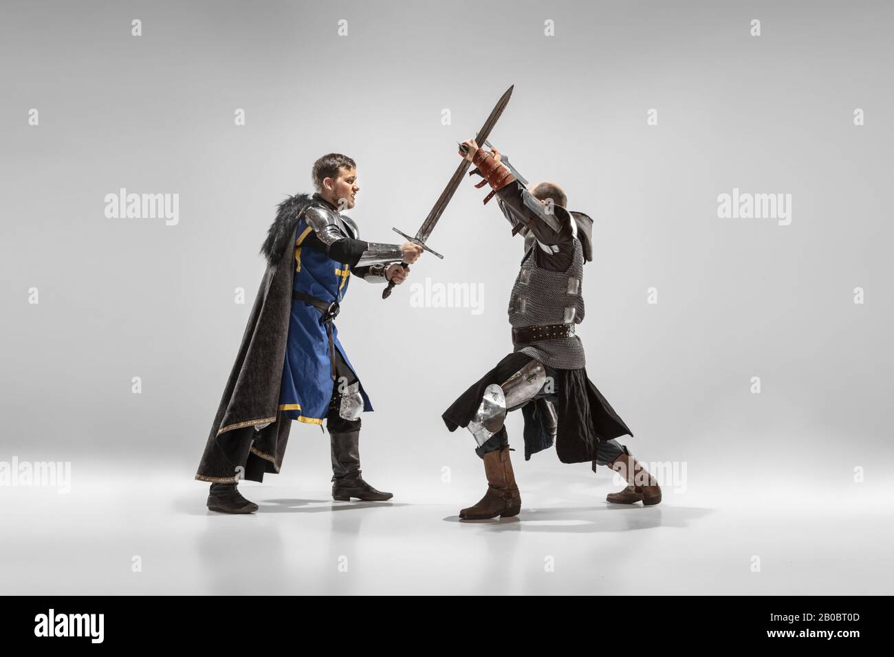 Brave armored knights with professional weapon fighting isolated on ...