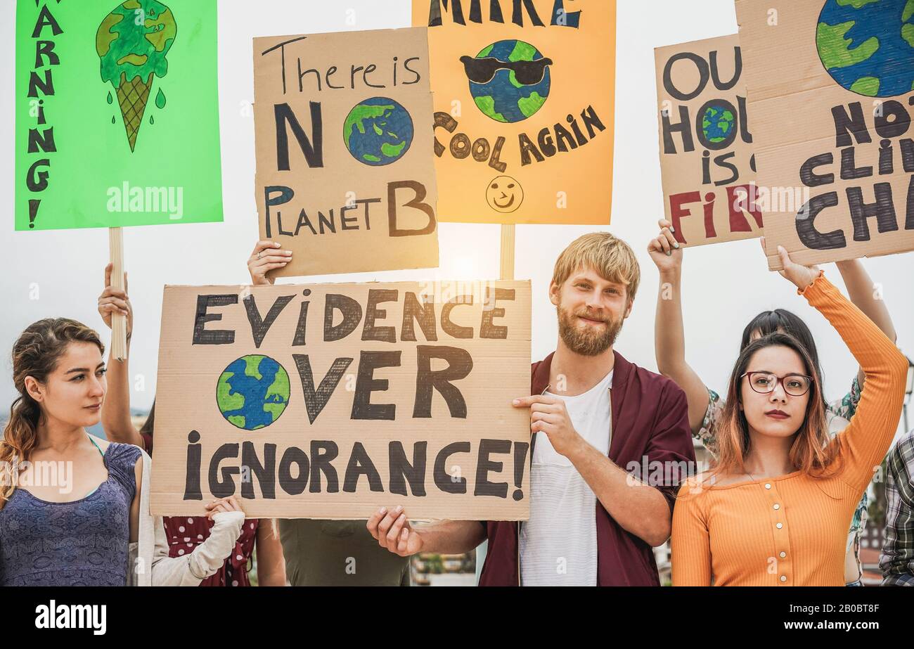 Group Of Demonstrators On Road Young People From Different Culture And Race Fight For Climate group-of-demonstrators-on-road-young-people-from-different-culture-and-race-fight-for-climate