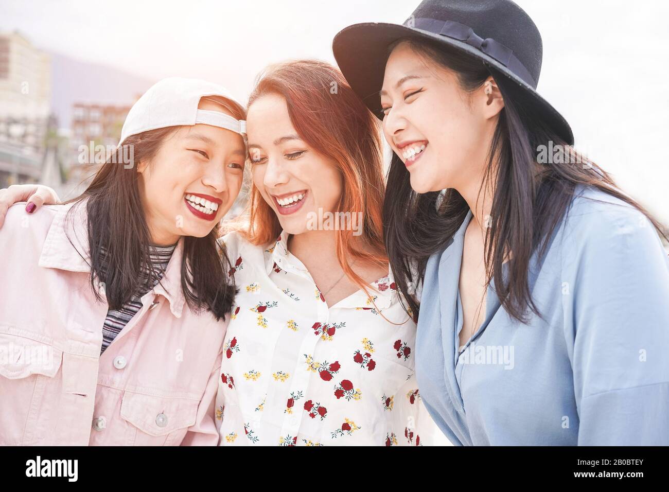 Asian women friends having fun outdoor in a sunny day - Happy trendy ...