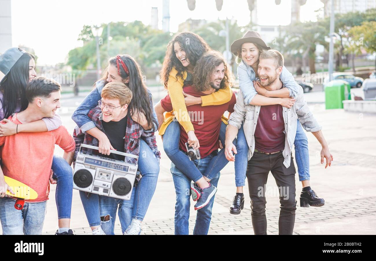 Happy friends having fun walking on city street center outdoor - Young ...