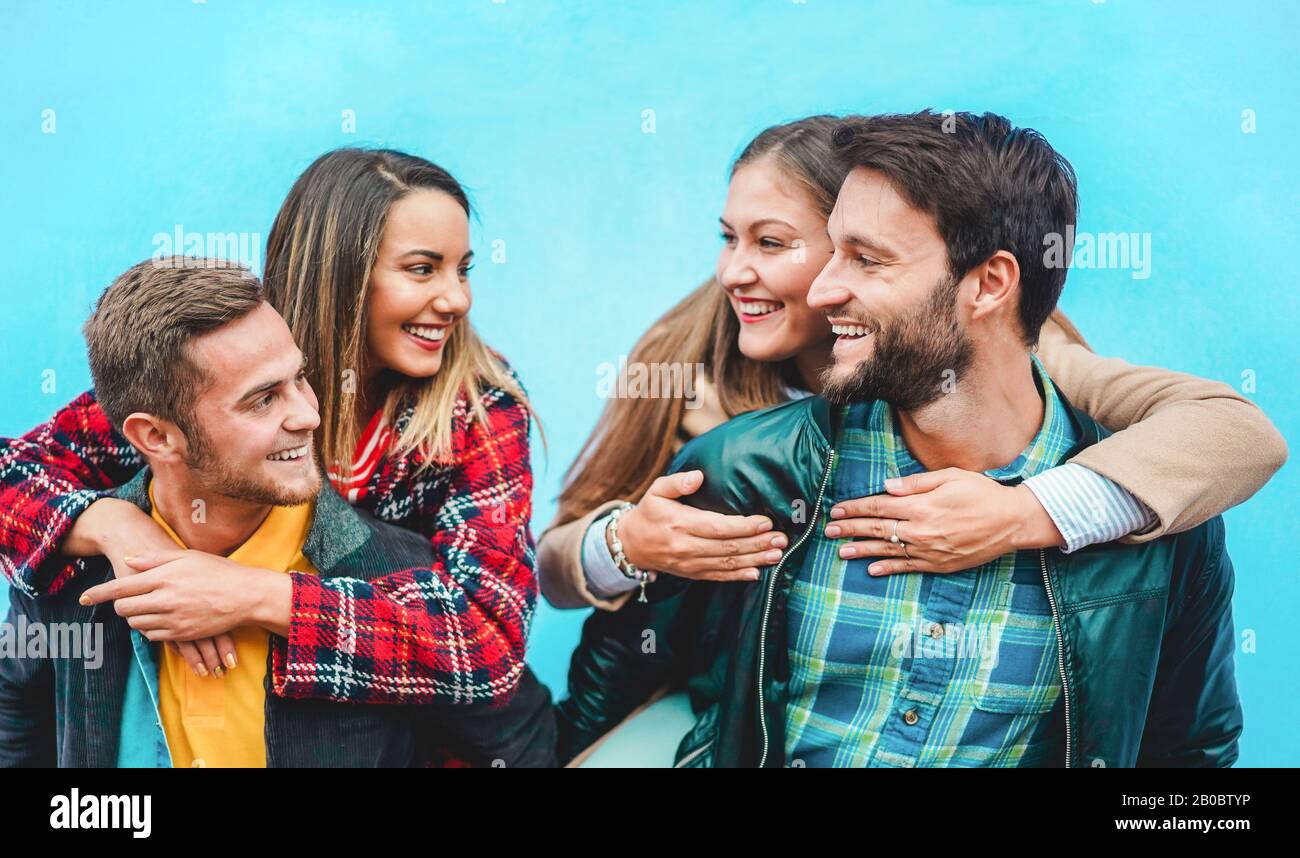 Happy friends having fun with turquoise wall background - Students ...
