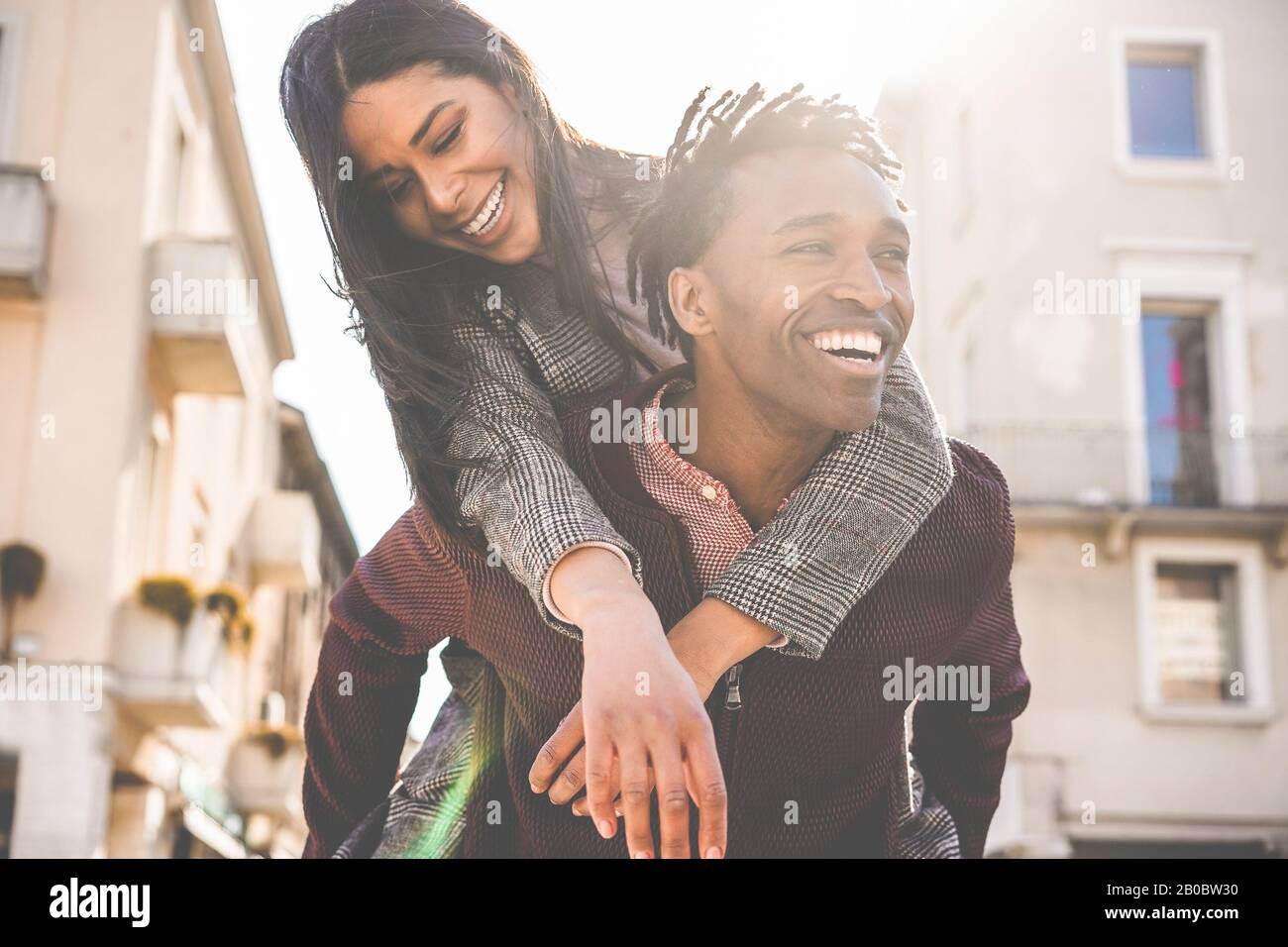 African couple having fun outdoor in city tour - Young people lovers ...