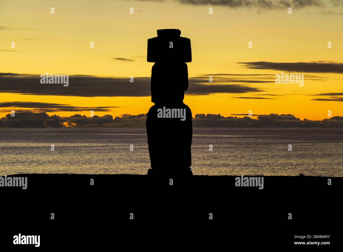 Sunset over Easter Island with Moai silhouette Stock Photo - Alamy