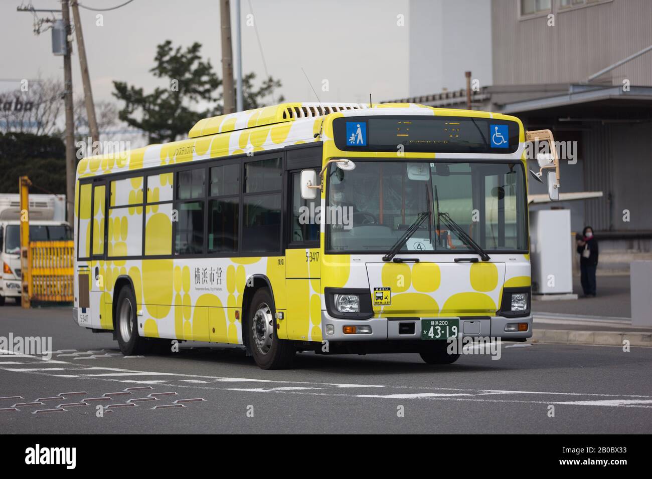 Bus operator drives towards the Diamond Princess Cruise Ship at the ...