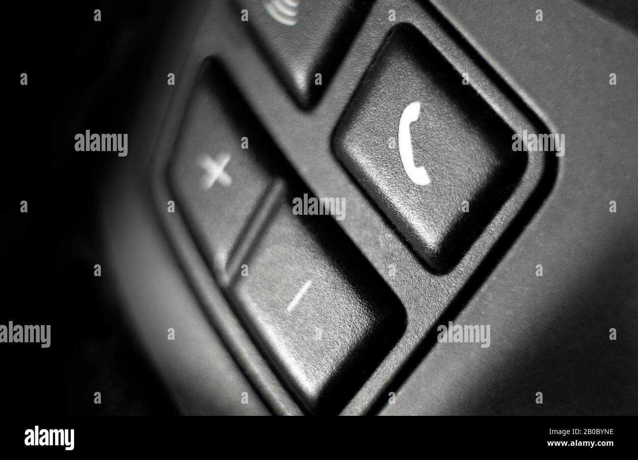 mobile phone buttons on car steering wheel Stock Photo - Alamy