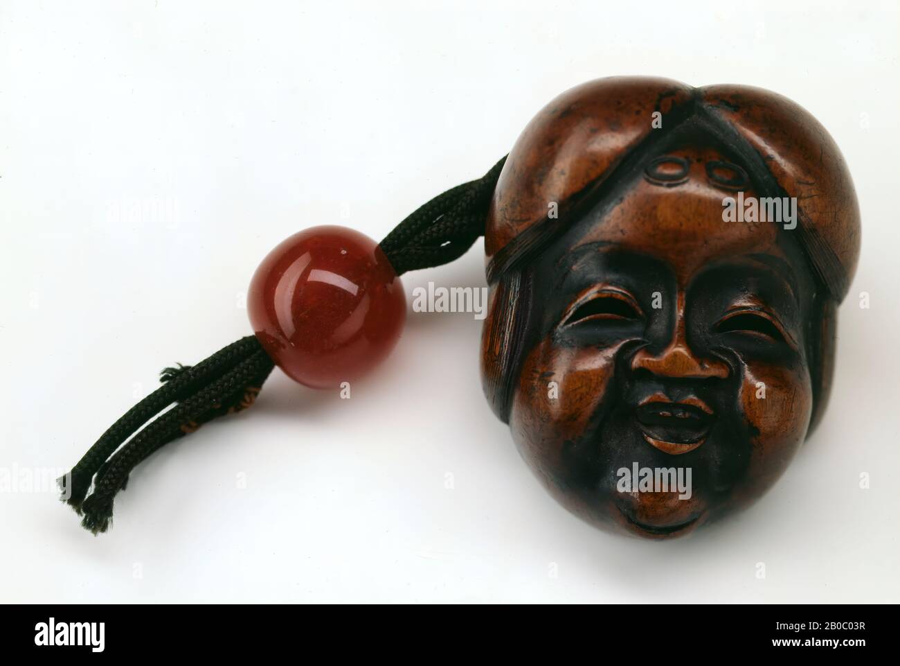 Unknown Artist, Netsuke: Mask of Okame, 1603-1868, wood with silk cord ...