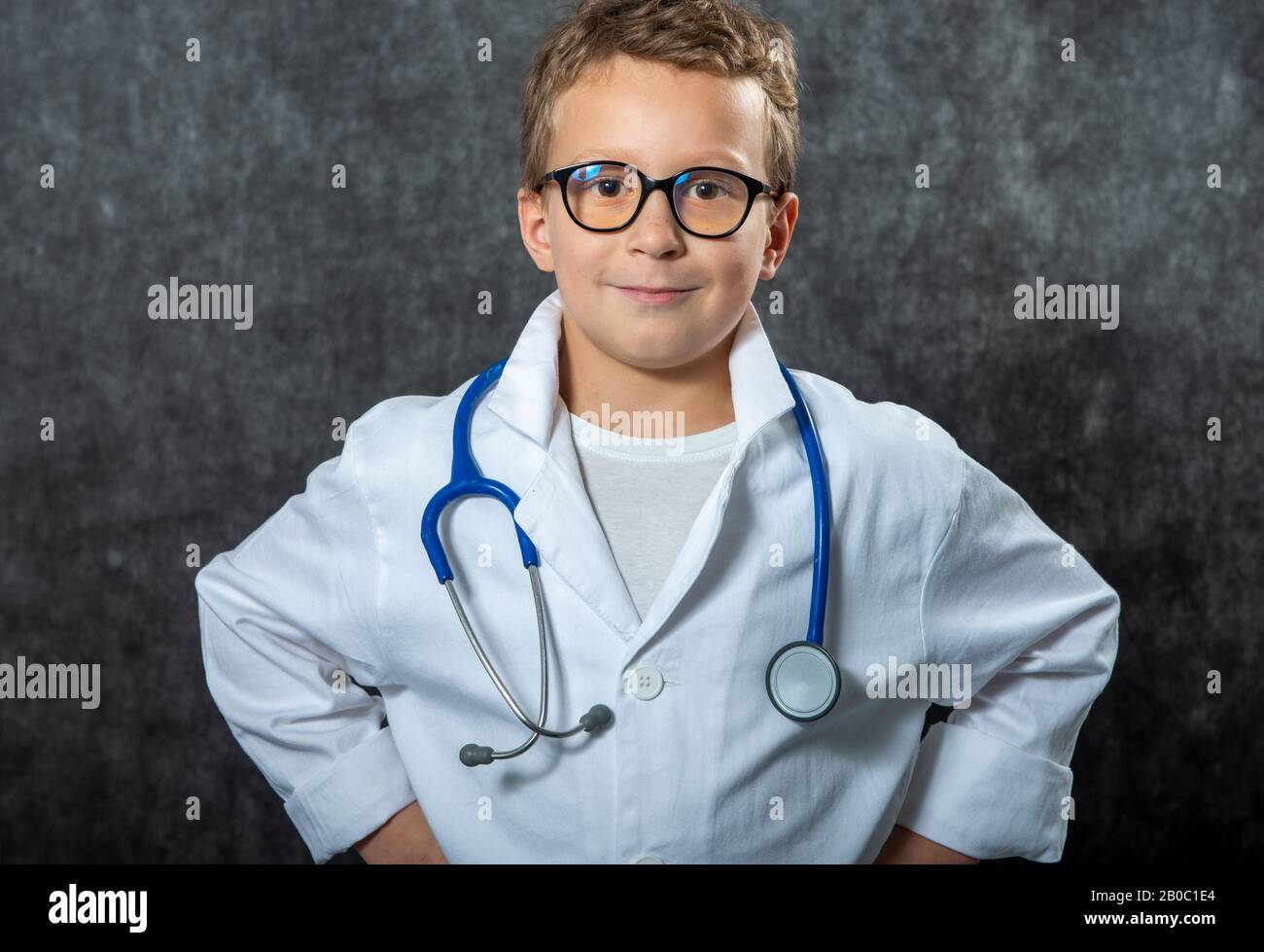 Cute kid boy wear medical uniform playing doctor, a portrait Stock ...