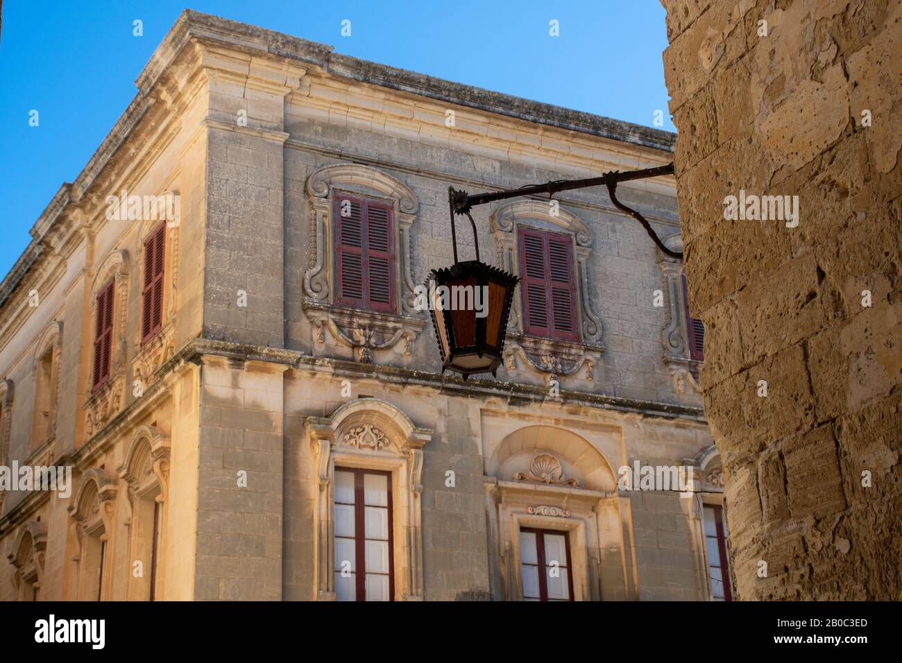 Traditional Maltese house in Mdina Malta with Lamp and red shutters ...