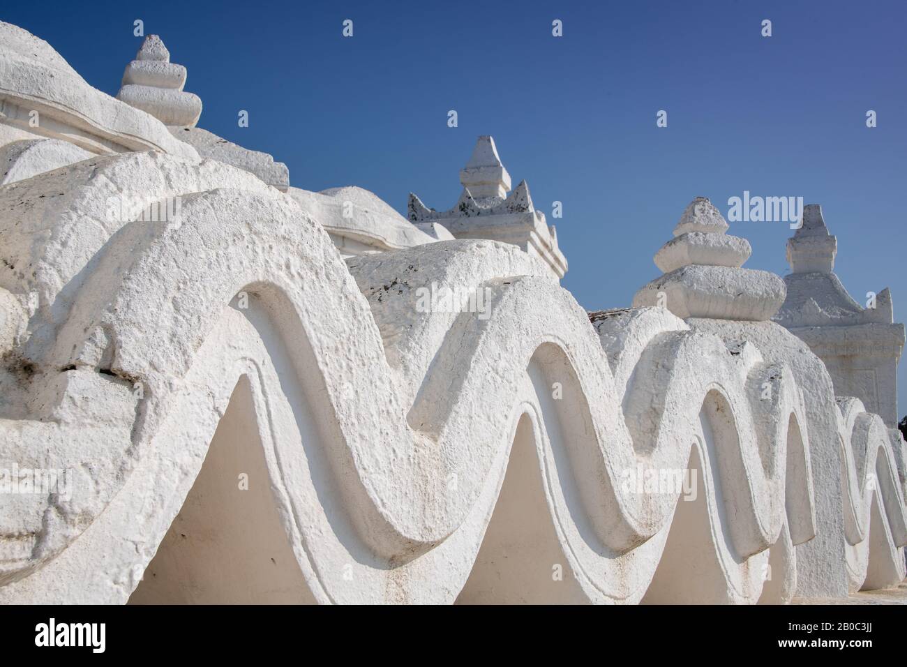 Hsinbyume Pagoda or Myatheindan pagoda. Close up view of white wavy ...