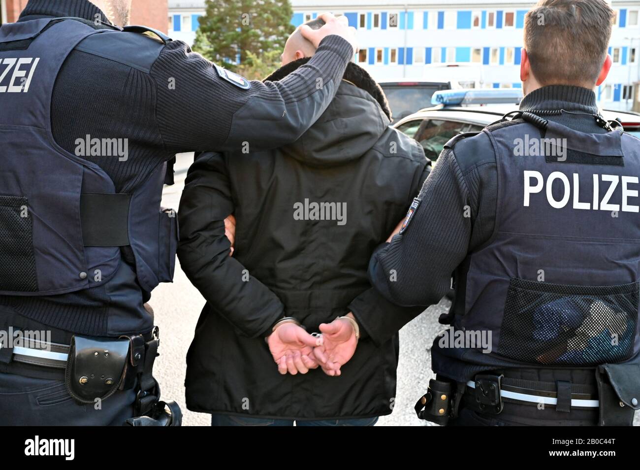19 February 2020, Schleswig-Holstein, Kiel: Staged scene of an arrest ...