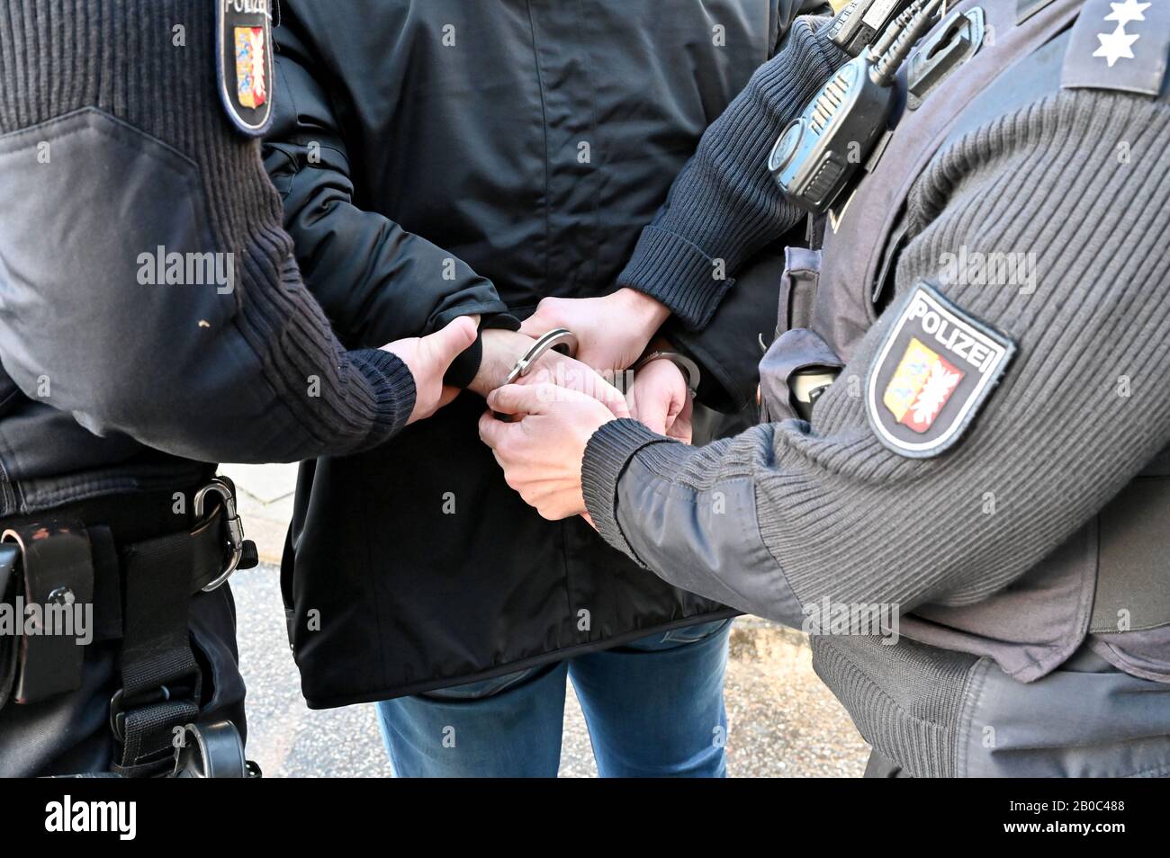 19 February 2020, Schleswig-Holstein, Kiel: Staged scene of an arrest ...