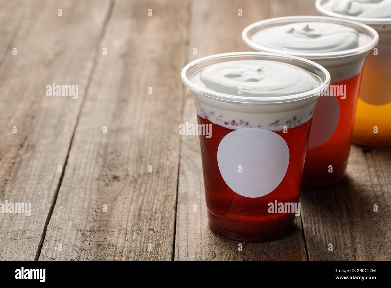 Tea topped with creamy foam. Cups of trendy drink Stock Photo - Alamy