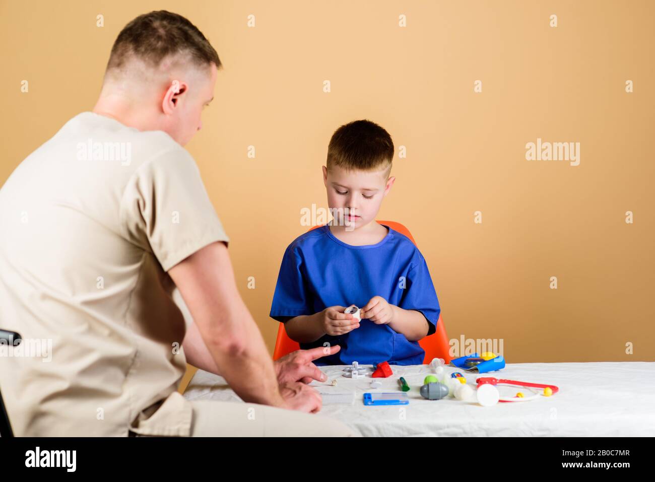 Medical service. Analysis laboratory. Kid little doctor sit table ...