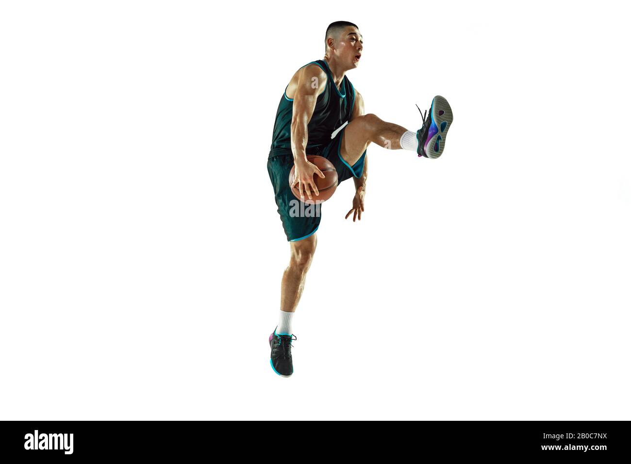 Young basketball player of team wearing sportwear training, practicing ...